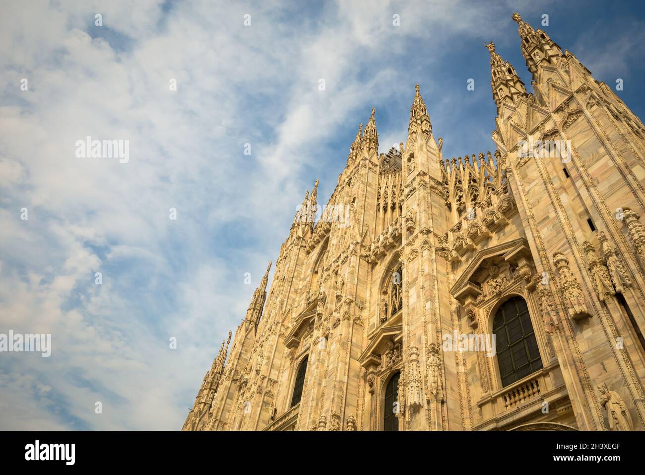 Milan Cathedral (Duomo di Milano) with blue sky and sunset light Stock ...