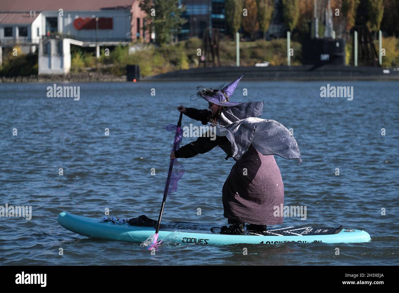 A participant takes part in the Fourth Annual Stand Up Paddleboard ...