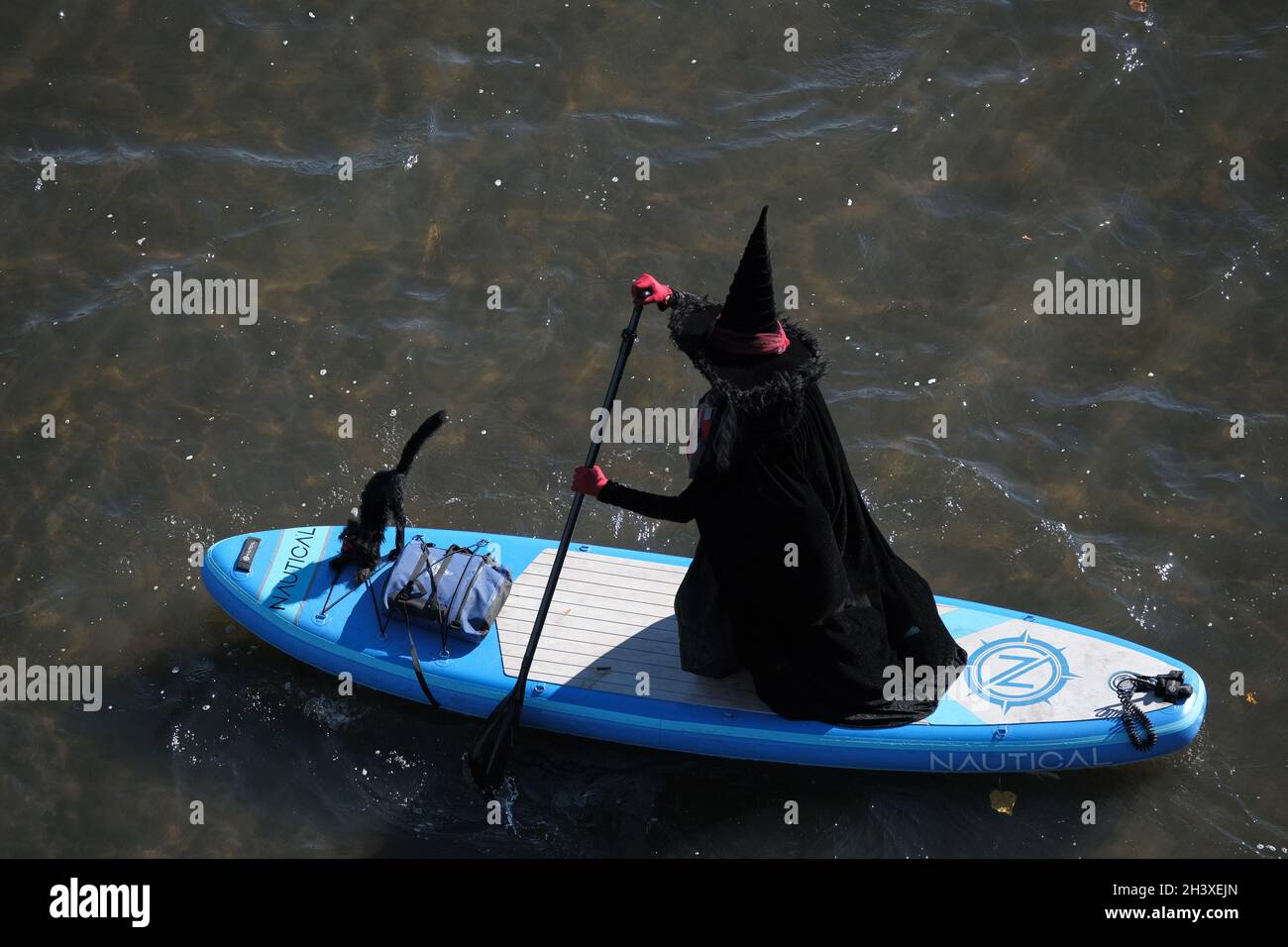 A participant takes part in the Fourth Annual Stand Up Paddleboard ...