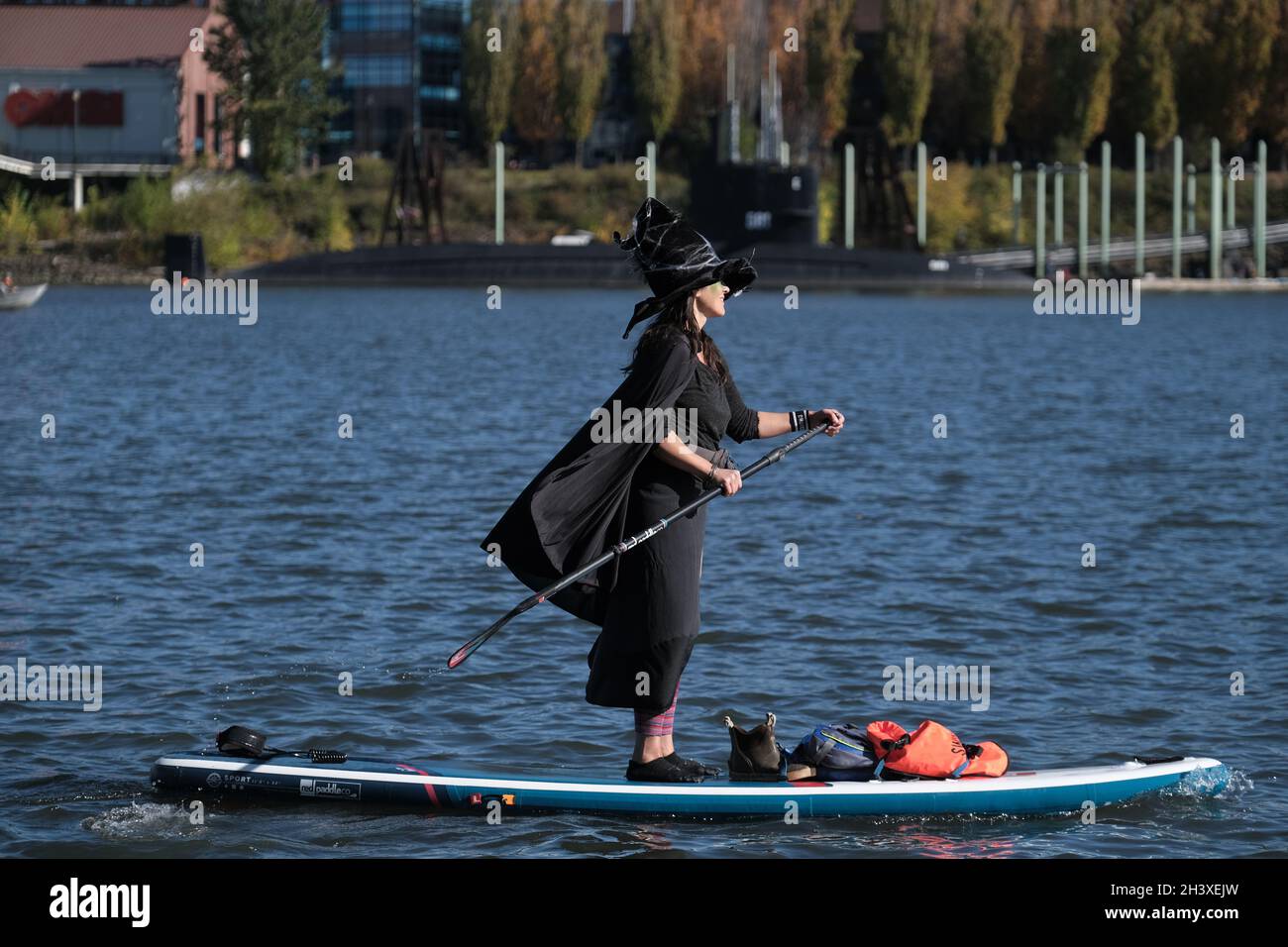 A participant takes part in the Fourth Annual Stand Up Paddleboard ...