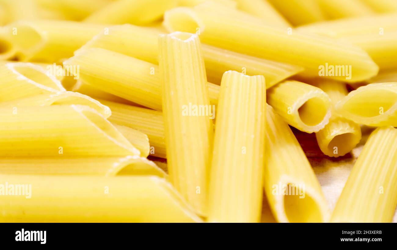 Penne Rigate Raw Pasta is a short pasta with oblique cuts and a ribbed ...