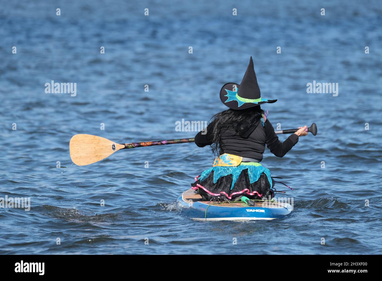 A participant takes part in the Fourth Annual Stand Up Paddleboard ...
