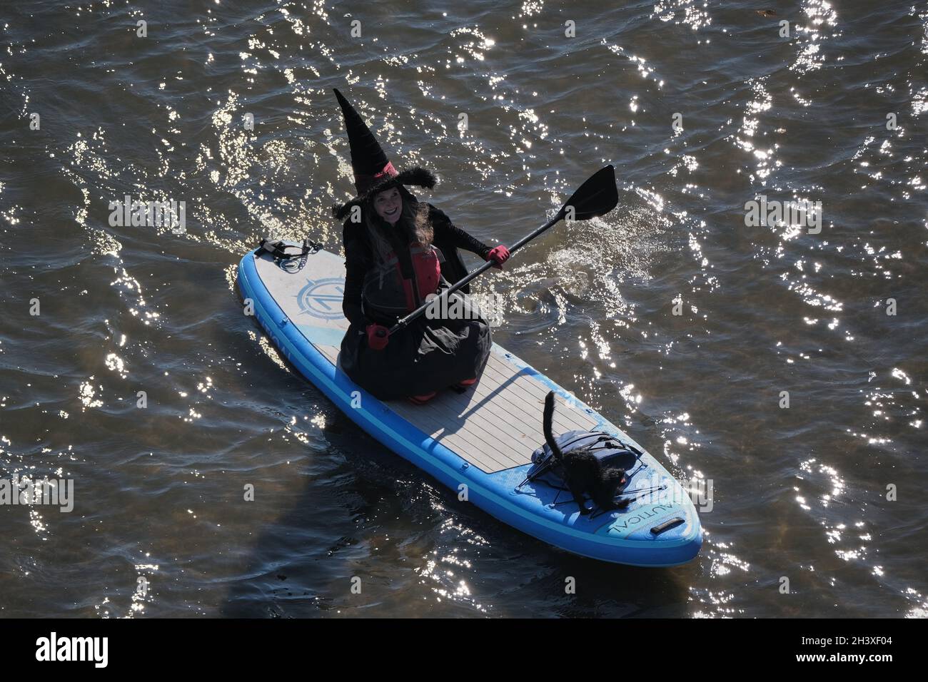 A participant takes part in the Fourth Annual Stand Up Paddleboard ...