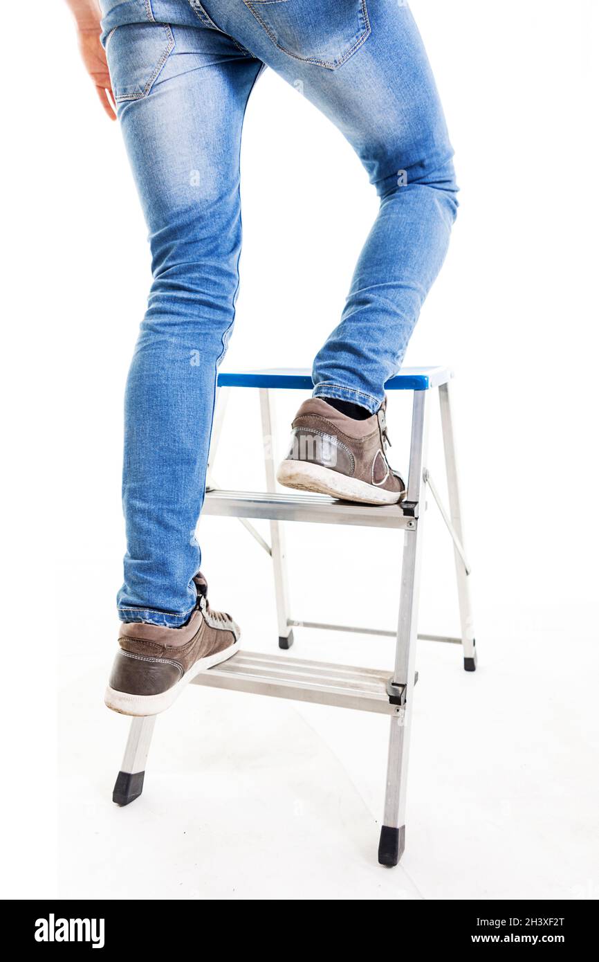 young worker climbing the ladder isolated on white Stock Photo - Alamy