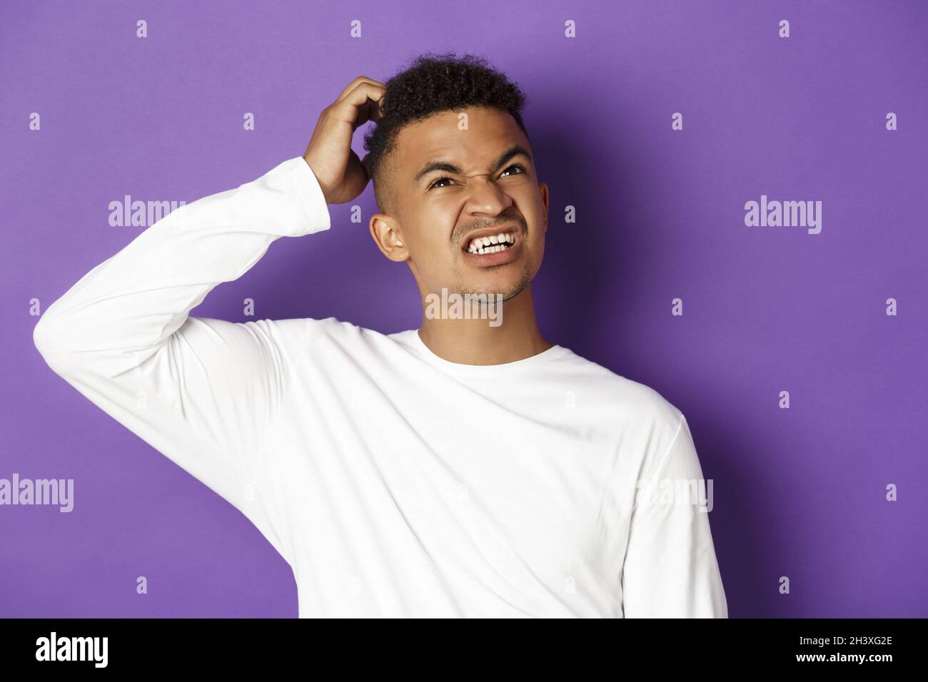 Close Up Of Troubled African American Man Thinking Scratch Head And