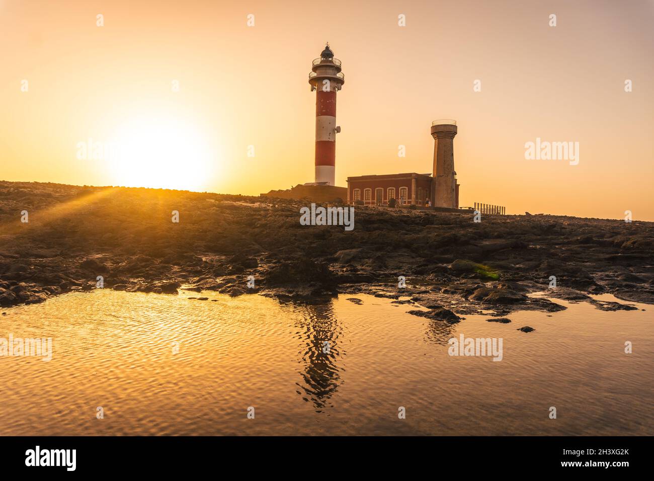 Beautiful view of the Toston Lighthouse at sunset in Punta Ballena ...