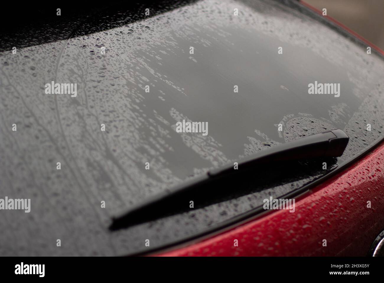 Parts of a wet car. Drops on the surface of the machine. Car after rain ...