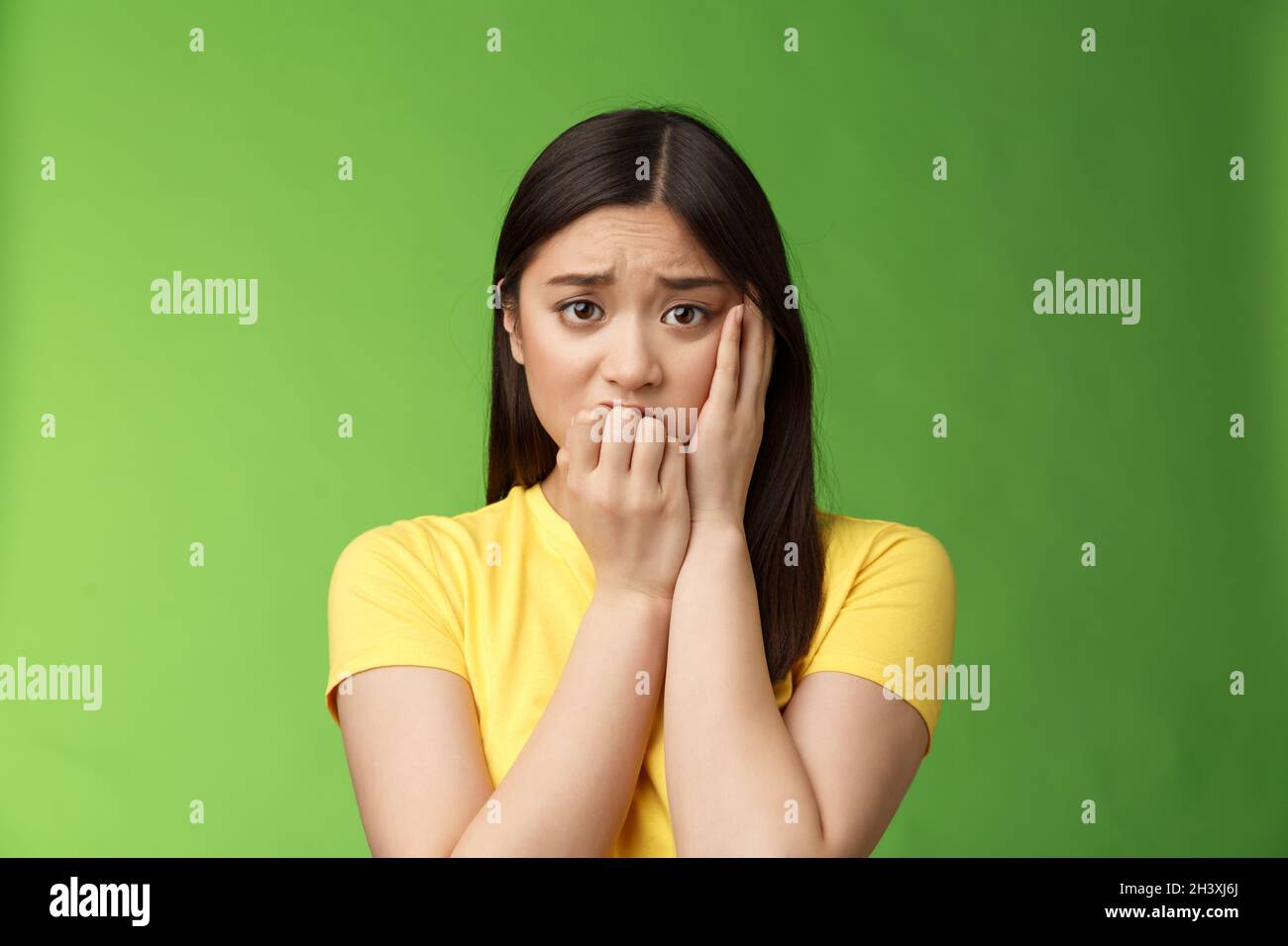 Innocent insecure timid asian scared girl panicking, standing afraid ...