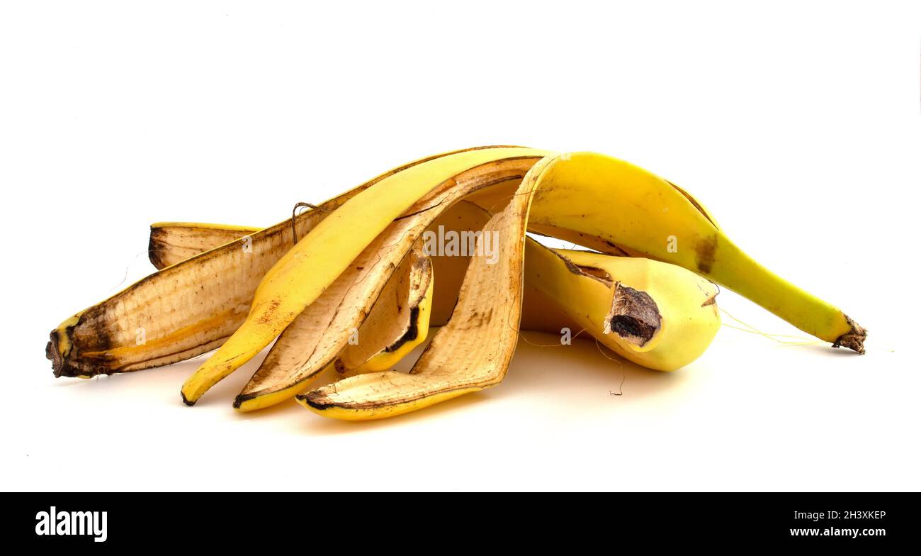 Banana peels on a white background Stock Photo - Alamy