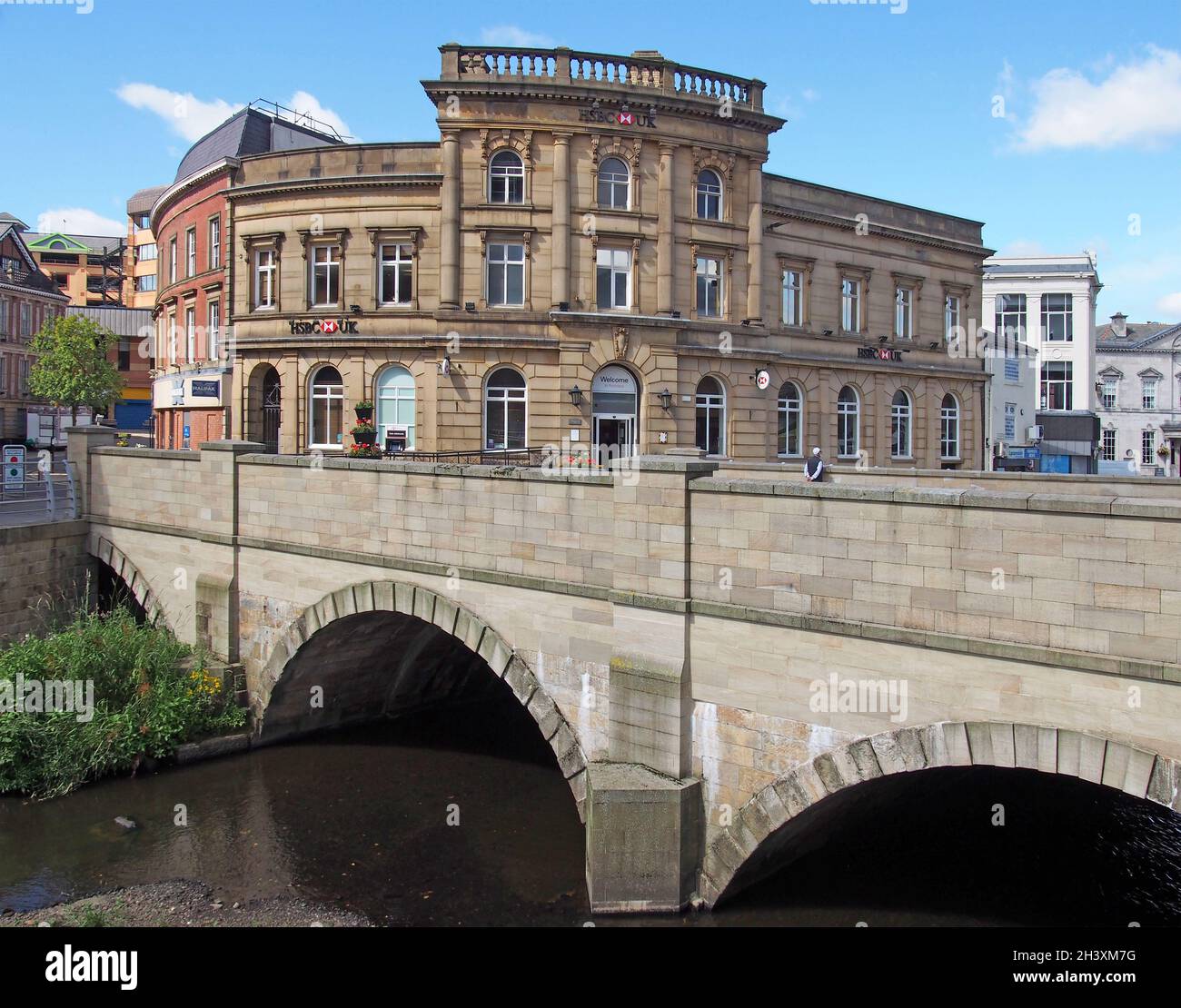 View of rochdale town centre with the bridge crossing the river and ...