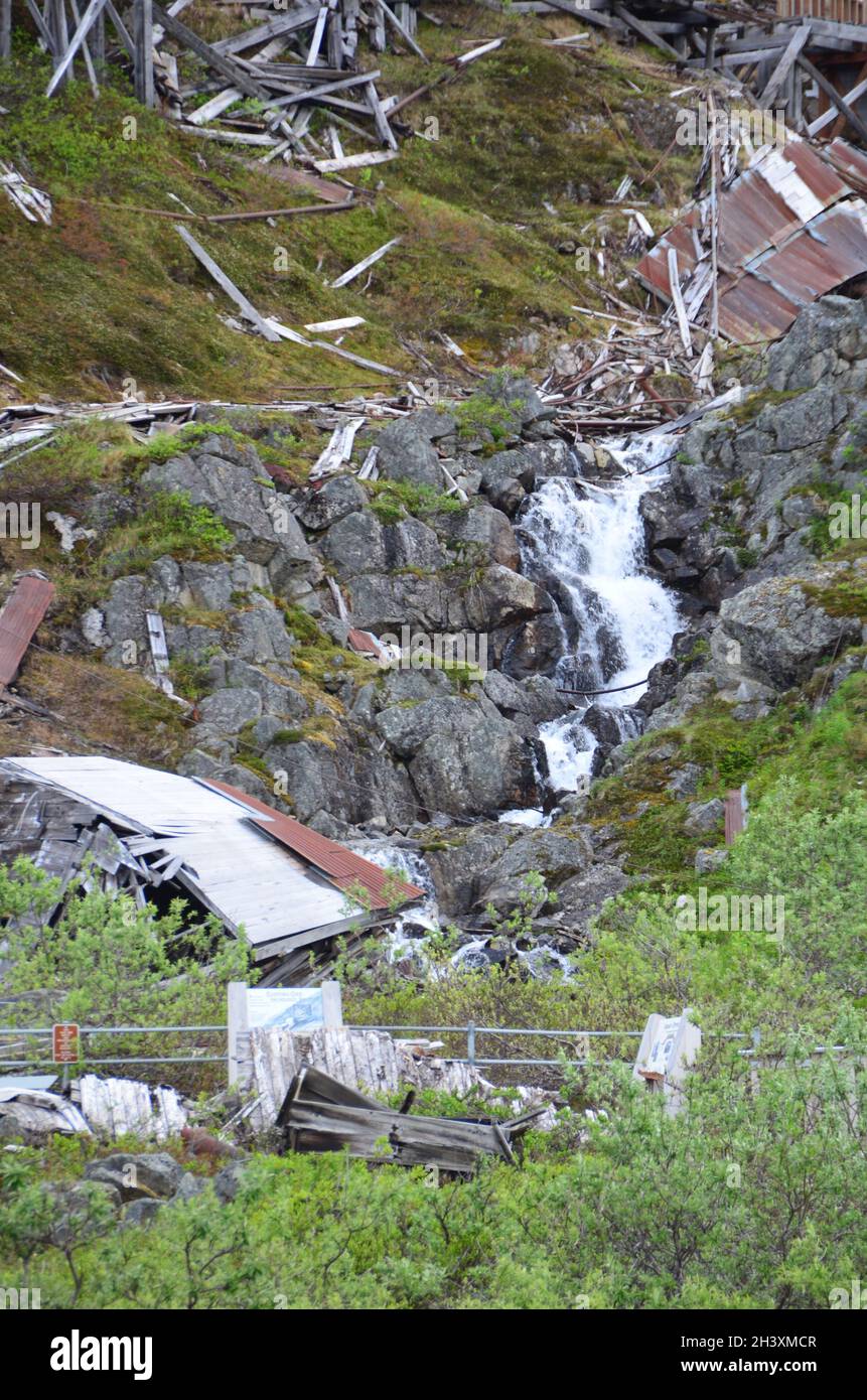 Vertical shot of collapsed house ruins on the mountain slope Stock ...