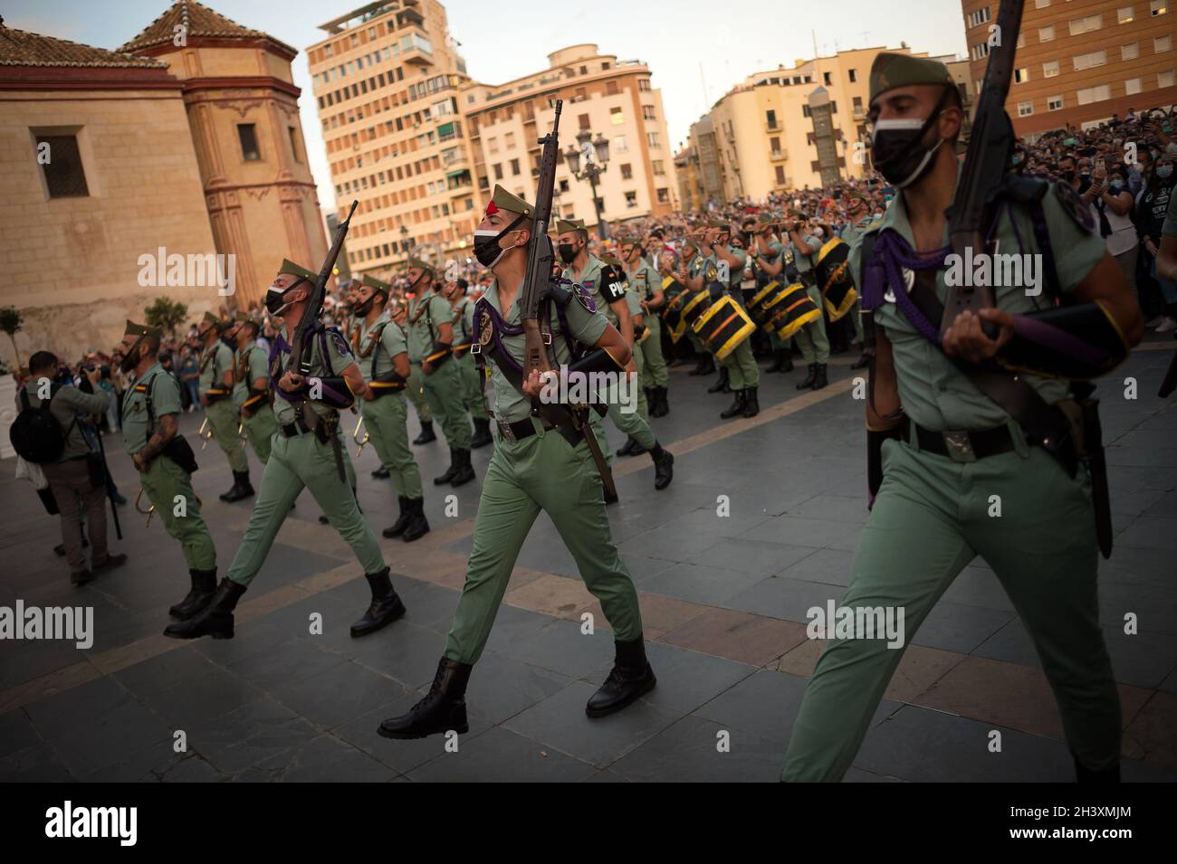 Spanish legionnaires marching with guns, during the procession.Sixteen ...