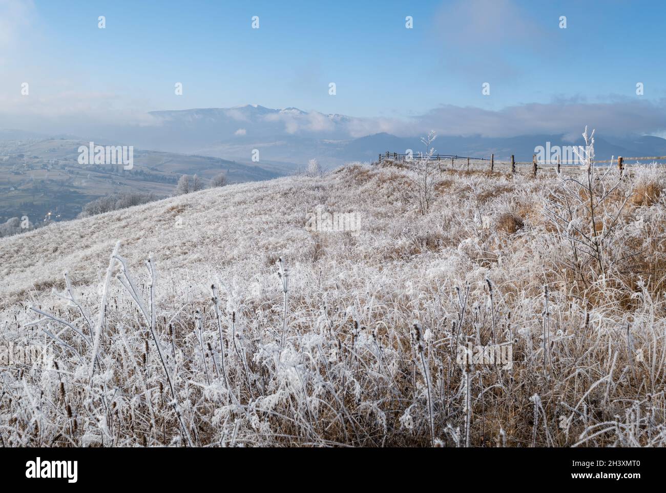 Winter coming. Picturesque moody morning scene in late autumn mountain countryside with ...