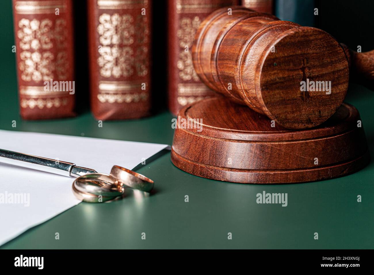 Law gavel and wedding rings on table Stock Photo - Alamy
