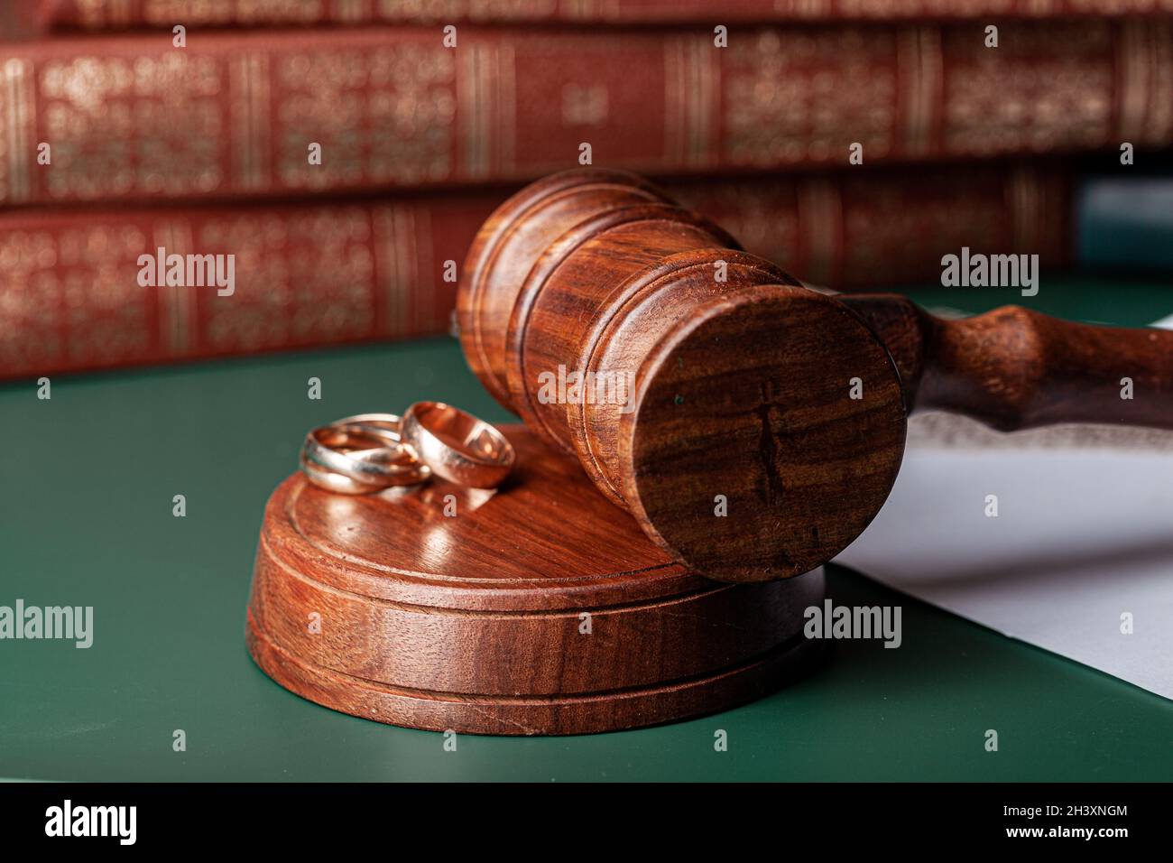 Law gavel and wedding rings on table Stock Photo - Alamy