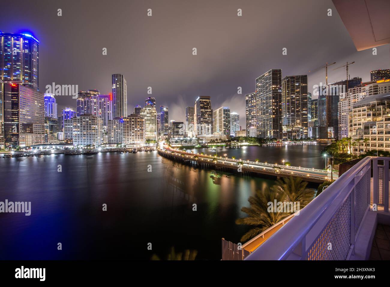 Miami skyline at night all lit up and glowing as seen from across the ...