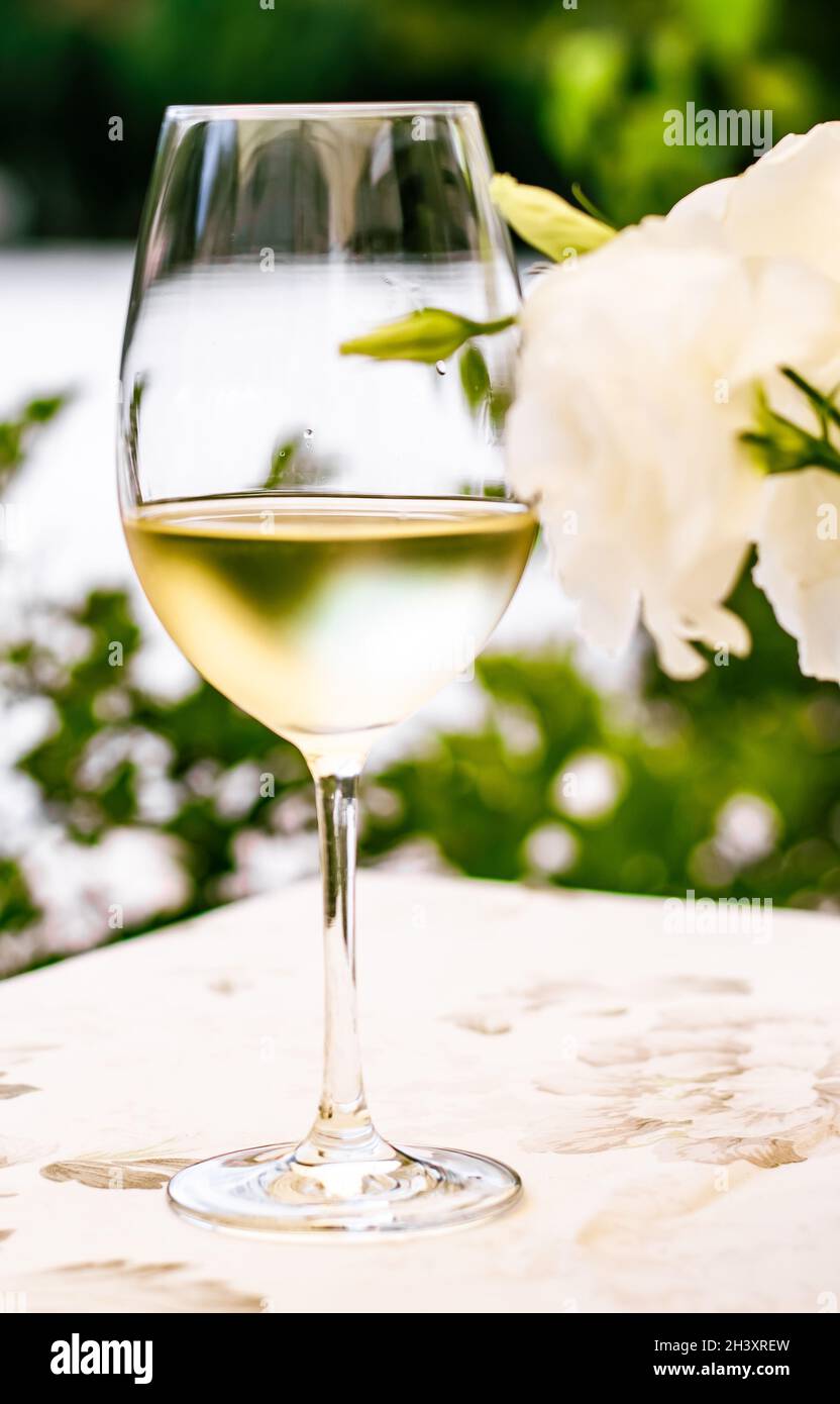 White wine in luxury restaurant on summer garden terrace, wine tasting ...