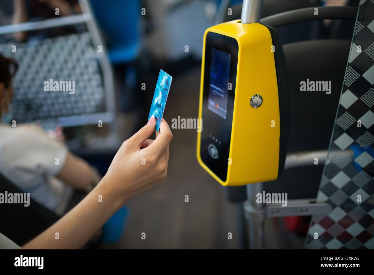 Asian woman paying conctactless with plastic card for the public ...