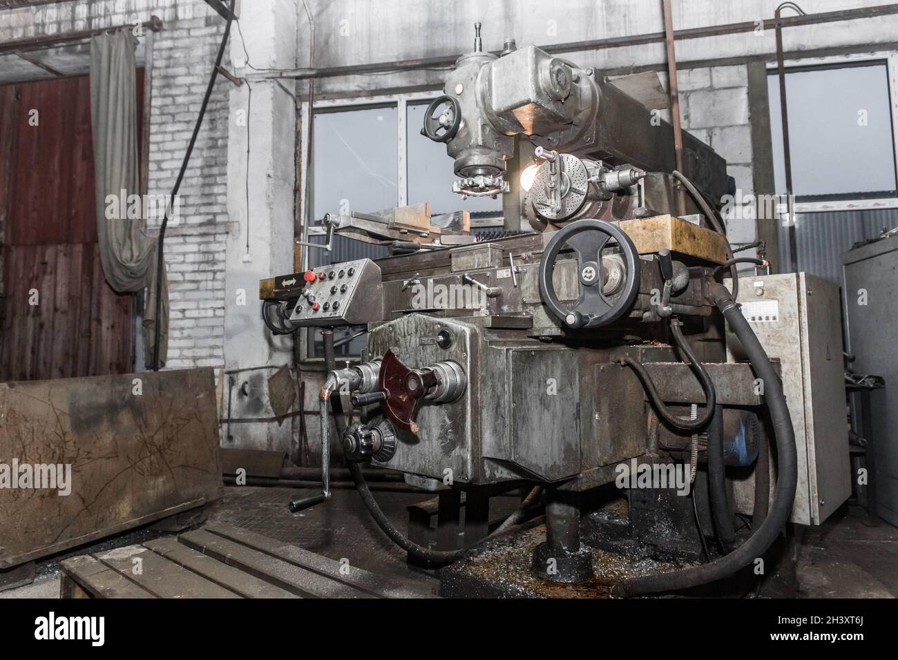 Old equipment milling machine for metal processing in the workshop of ...