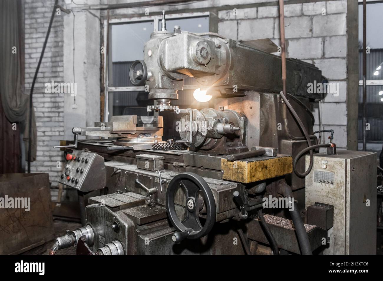 Old equipment milling machine for metal processing in the workshop of ...