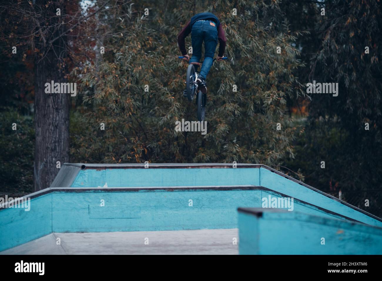 Professional young sportsman cyclist with bmx bike at skatepark Stock ...