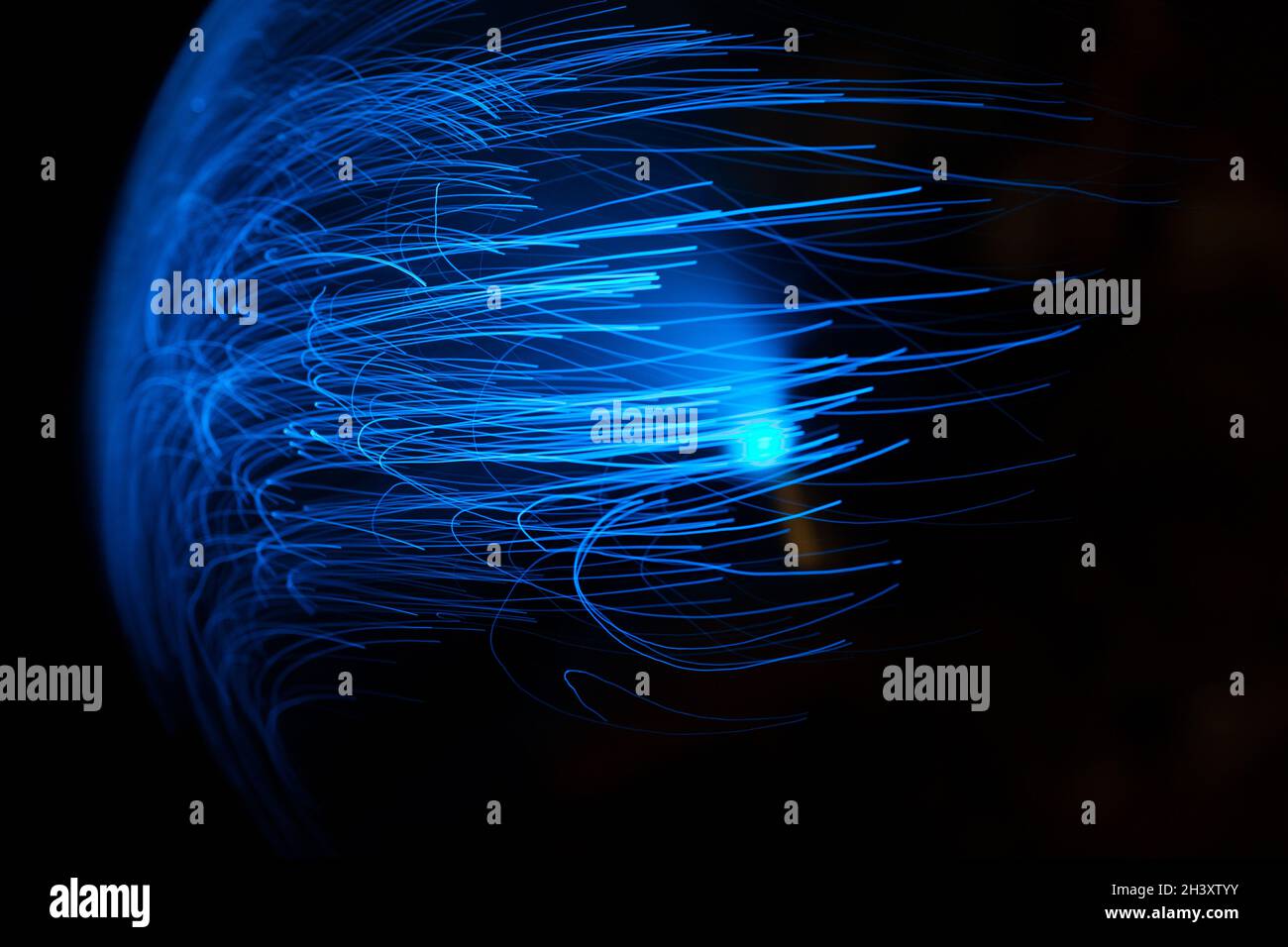 Blue abstract particles and lines with bokeh and blur in dark ...