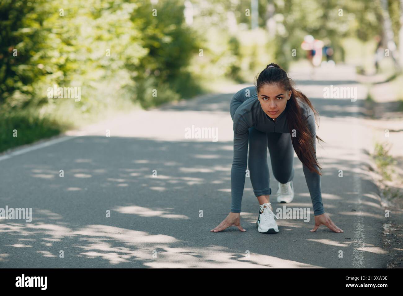 Woman athlete starting on track hi-res stock photography and images - Alamy
