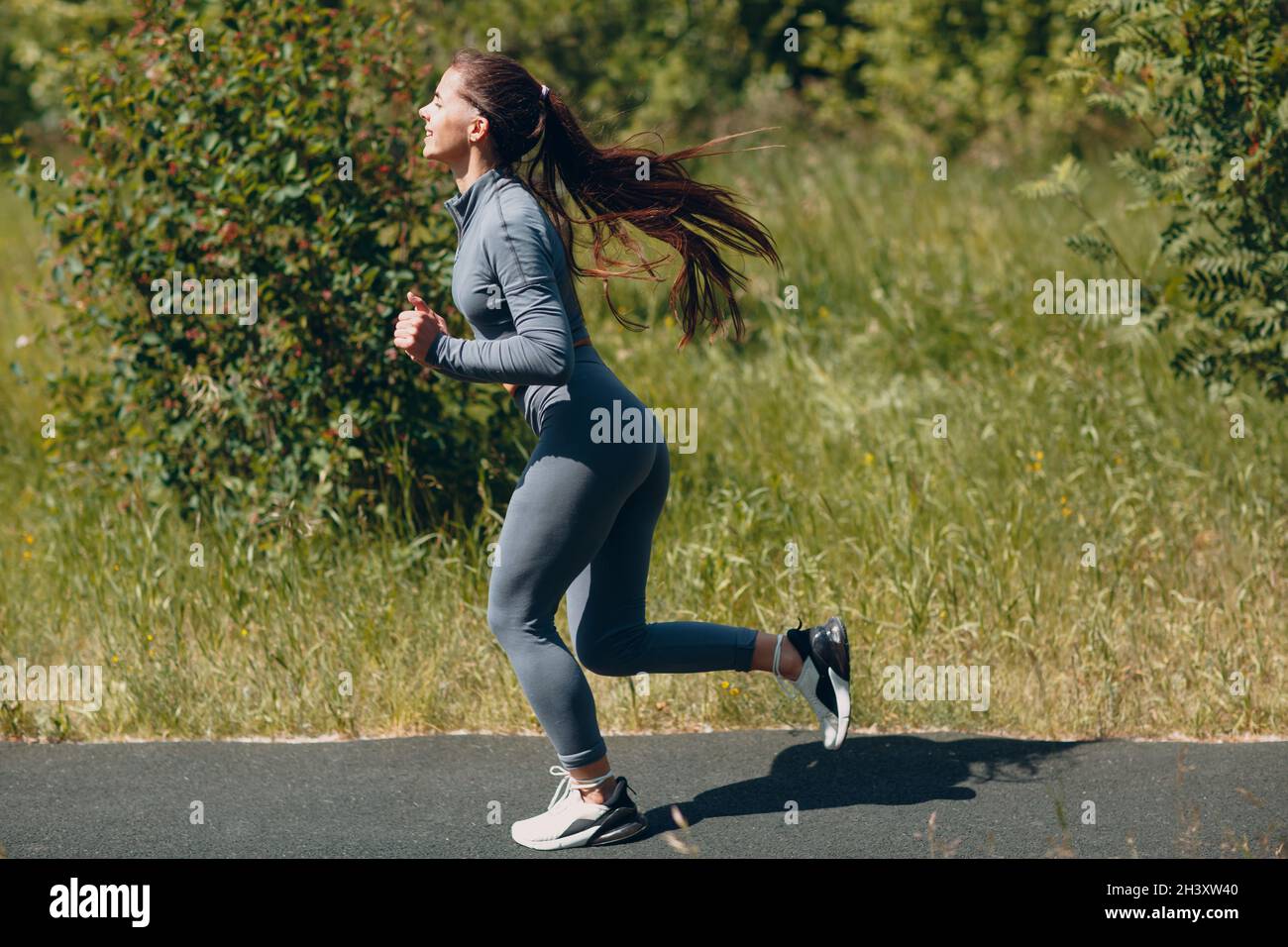 Running girl in city park. Young woman runner outdoor jogging Stock ...