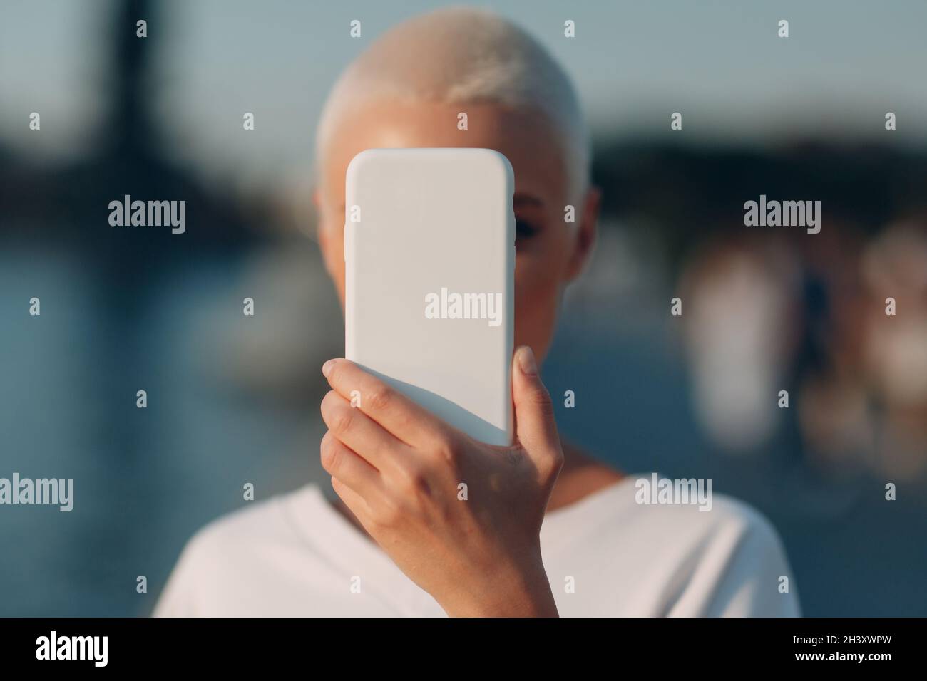 Covering face with cellphone hi-res stock photography and images - Alamy
