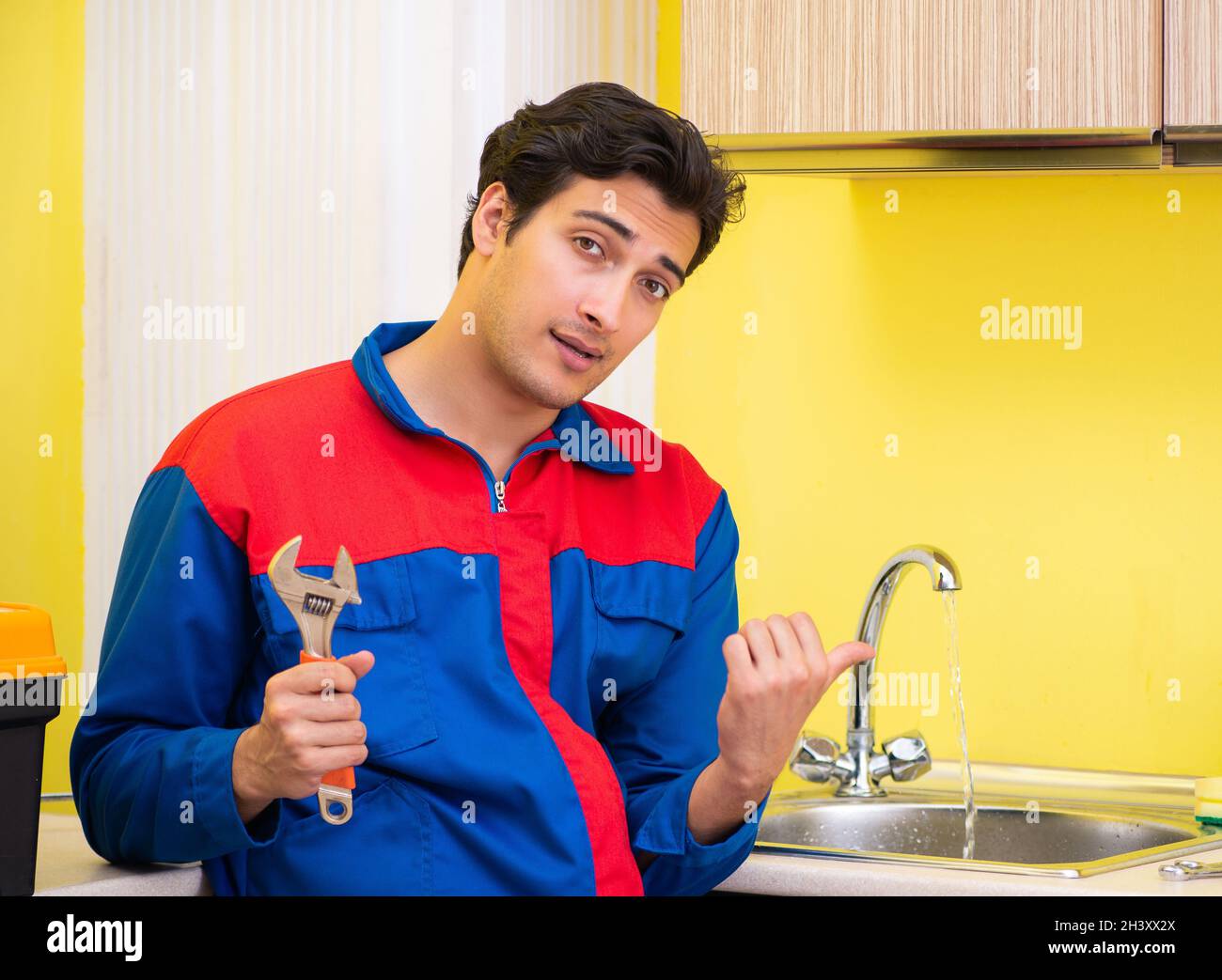 Faucet craftsman plumber installing hi-res stock photography and images ...