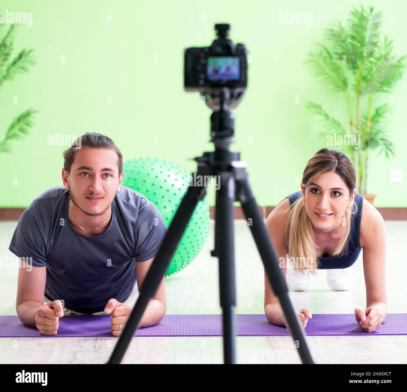 Fitness instructor recording workout hi-res stock photography and ...