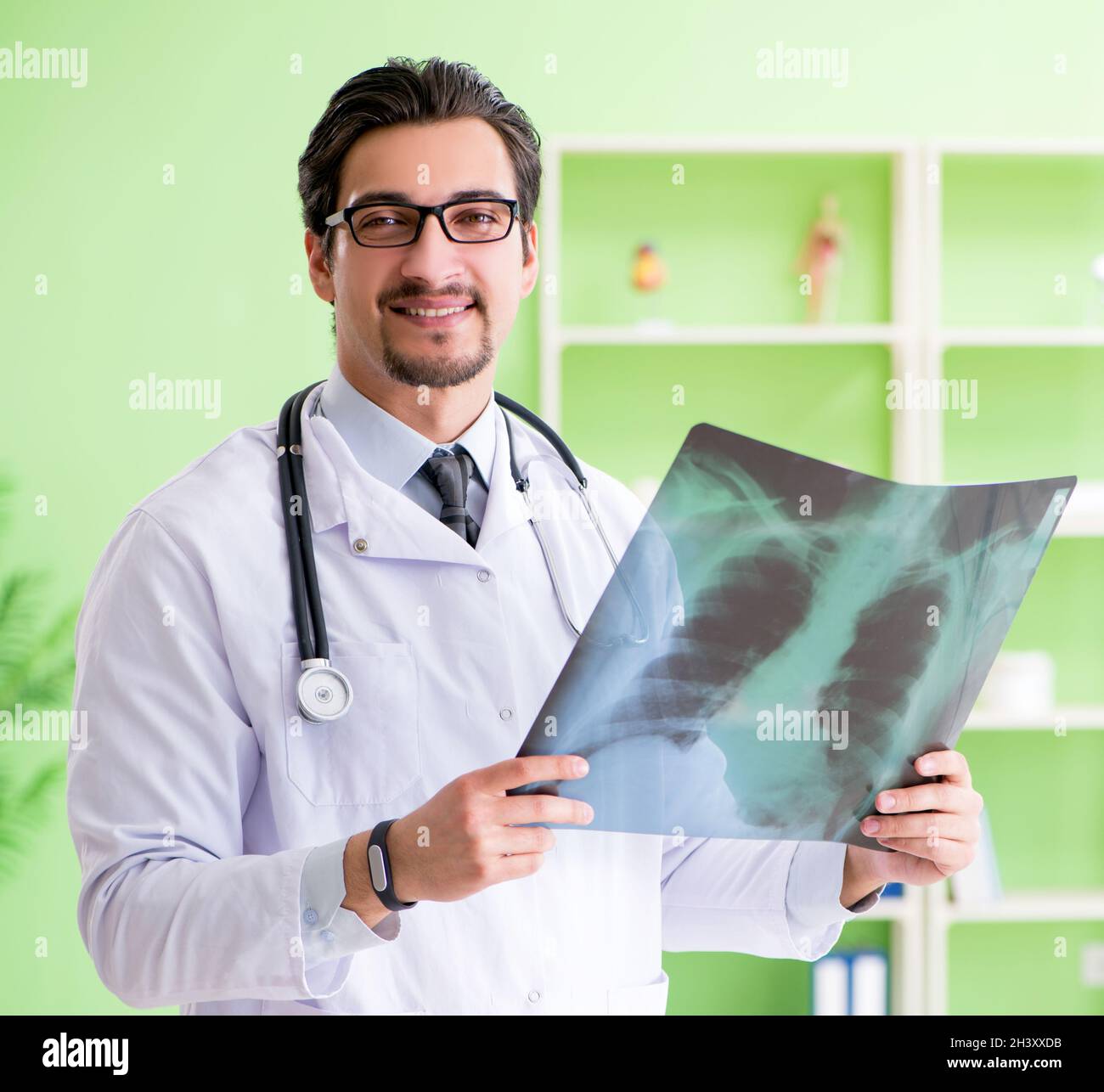 Doctor radiologist looking at x-ray scan in hospital Stock Photo - Alamy