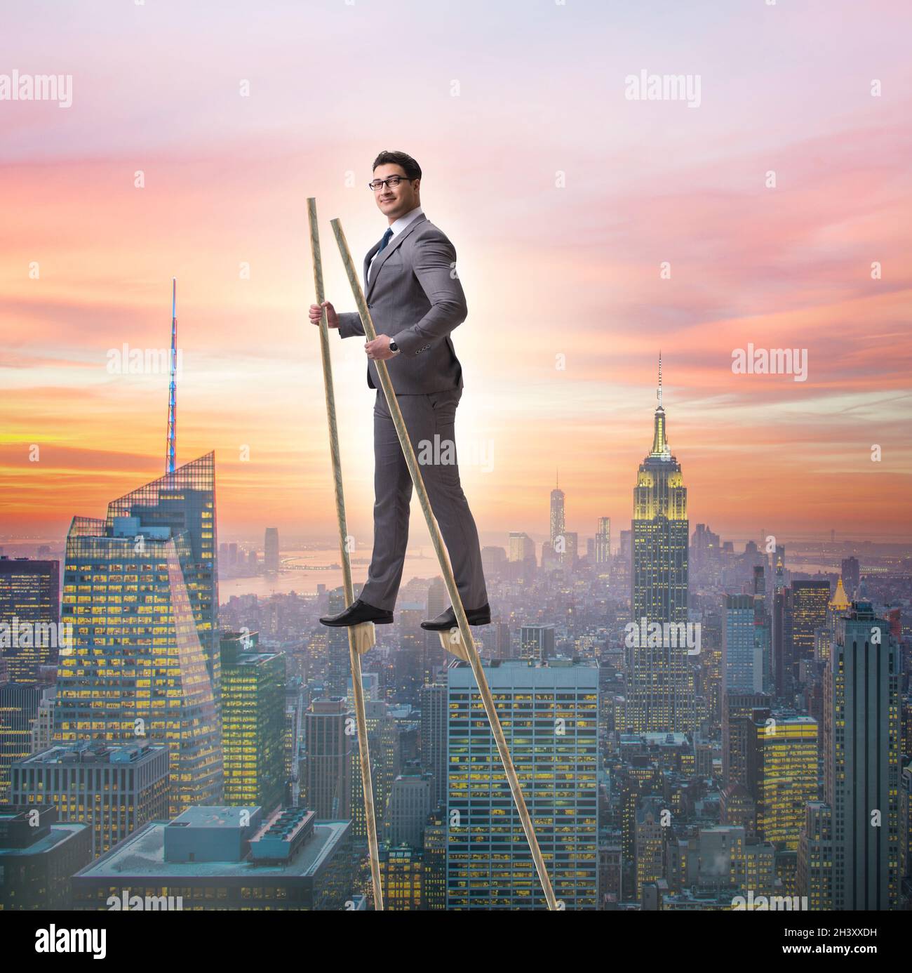 Businessman walking on stilts - standing out from the crowd Stock Photo ...