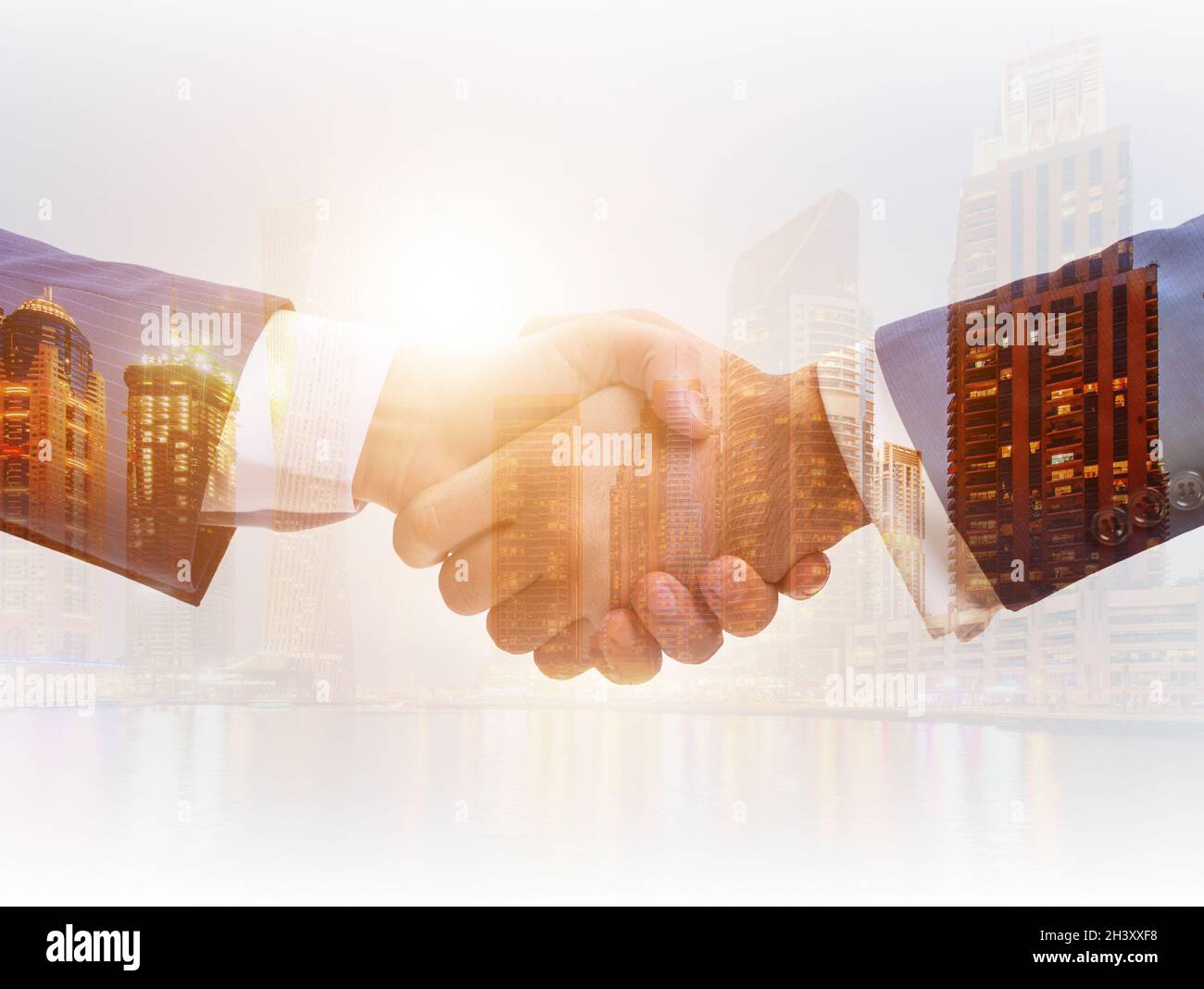 Concept of cooperation with handshake Stock Photo - Alamy