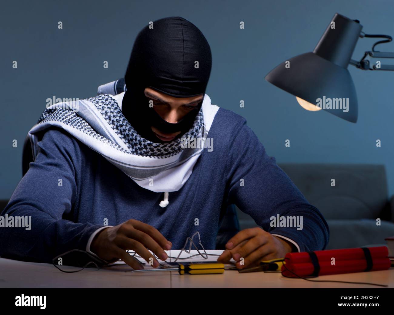 Terrorist bomber preparing dynamite bomb Stock Photo - Alamy
