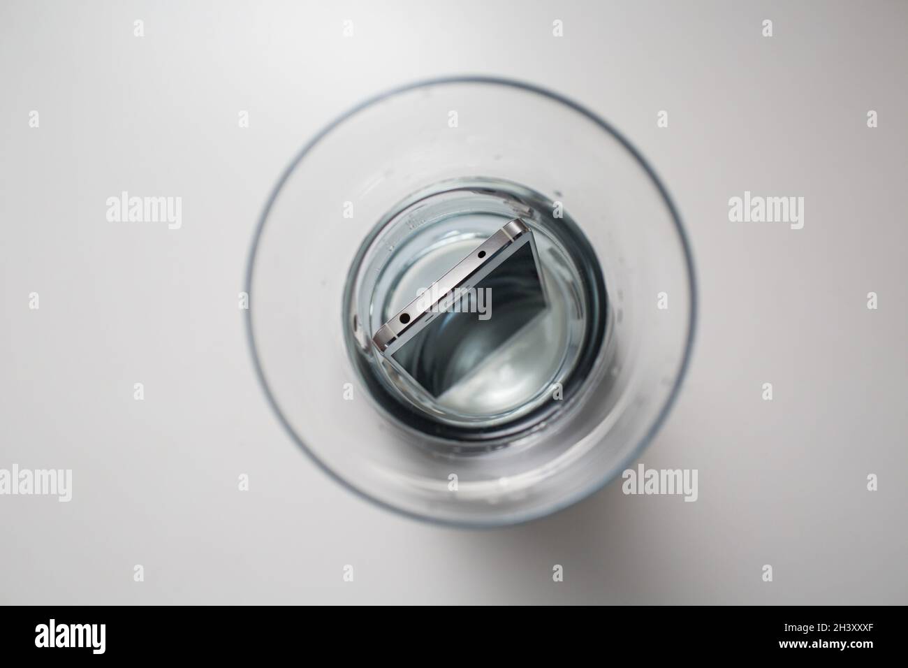 Mobile phone waterproof in vessel with water Stock Photo - Alamy