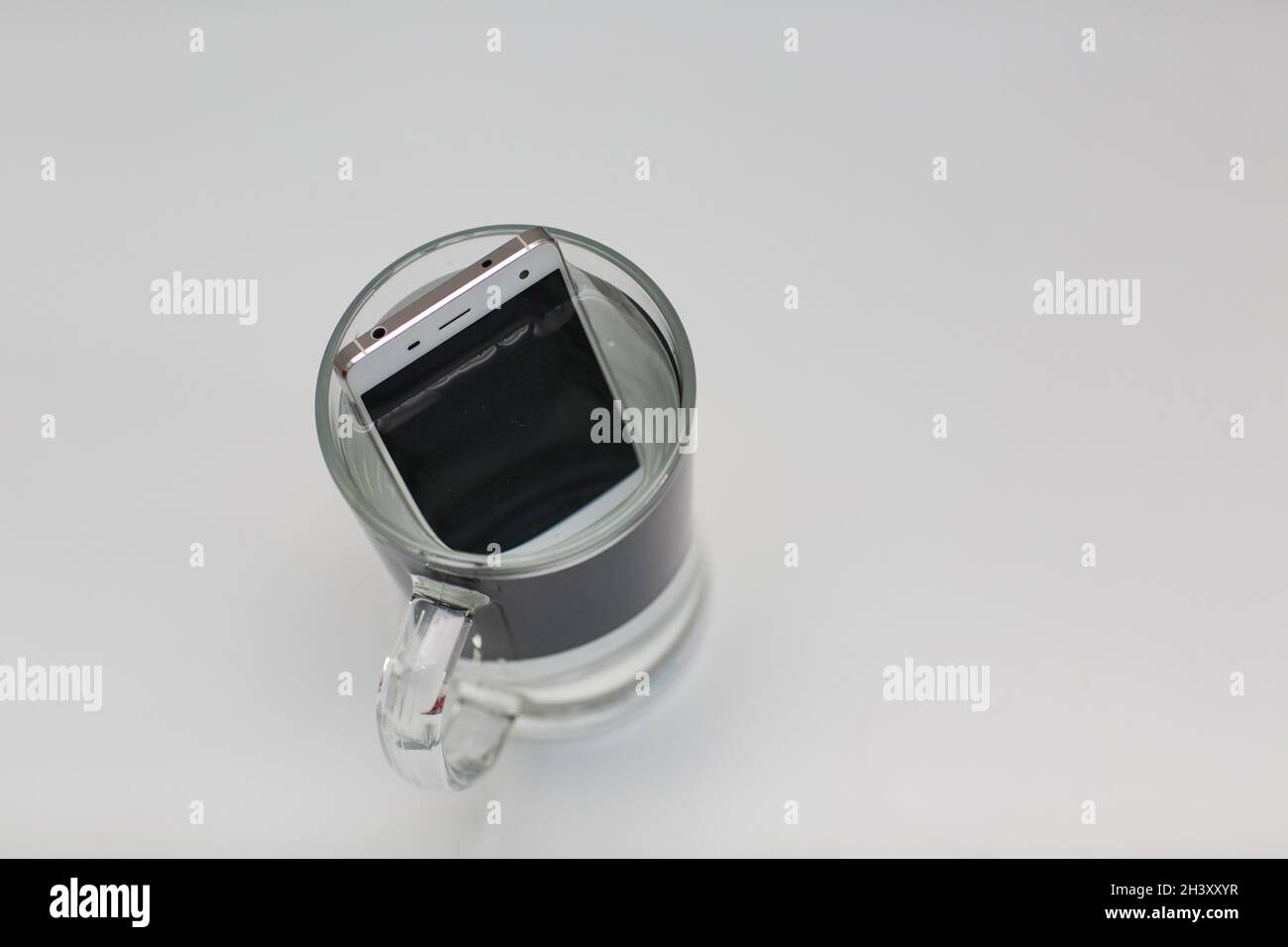 Mobile phone waterproof in vessel with water Stock Photo - Alamy