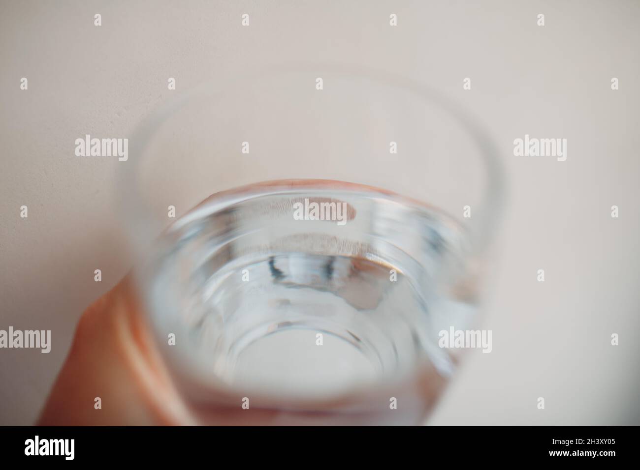 Transparent glass with water in man hand Stock Photo - Alamy