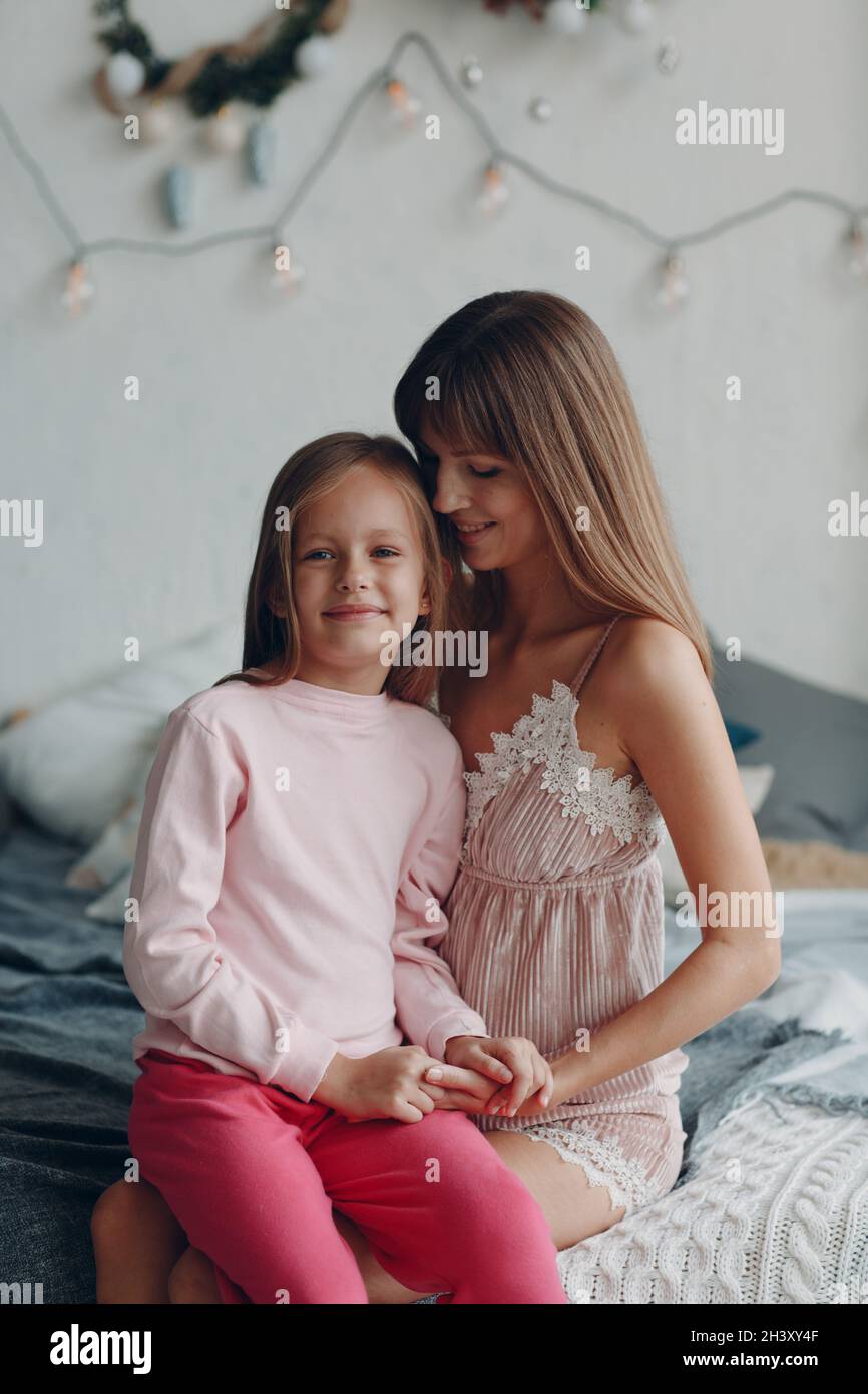 Mother and little daughter child girl at home Stock Photo - Alamy