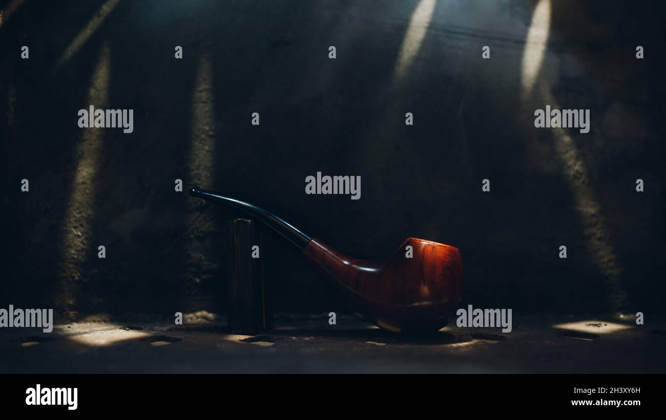 Smoking pipe on steel background with smoke Stock Photo - Alamy