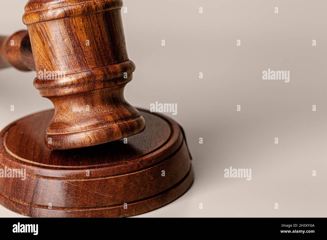 Wooden judges gavel on table close up Stock Photo - Alamy