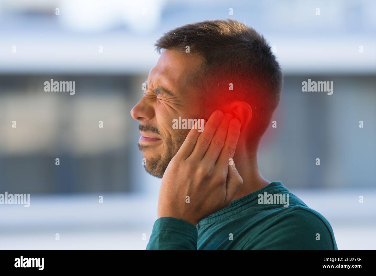 Man suffering from of strong earache or ear pain. Otitis Stock Photo ...
