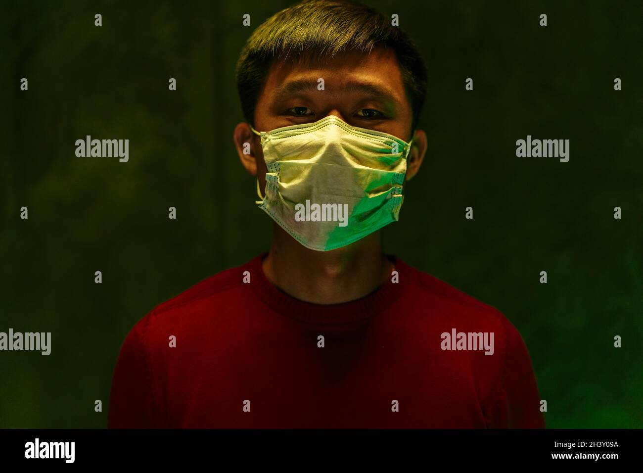 Portrait of a Chinese man wearing medical protective mask. Coronavirus ...
