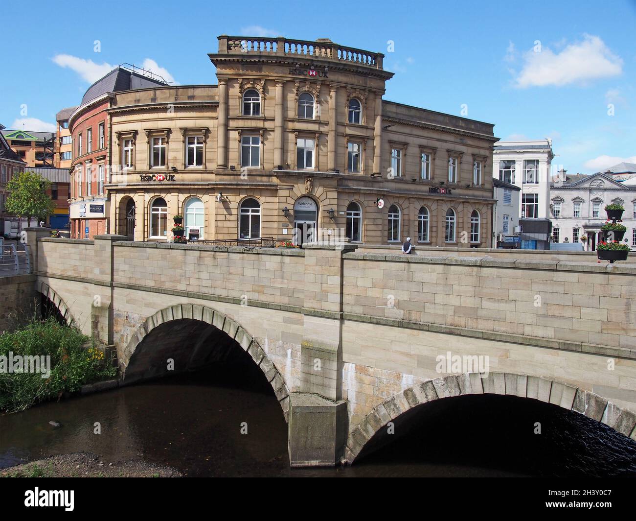 View of rochdale town centre with the bridge crossing the river and ...
