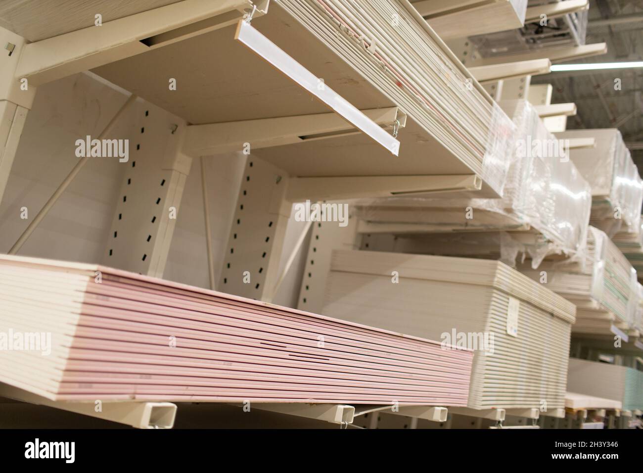 Pallet with Drywall sheets plasterboard in the building warehouse store ...