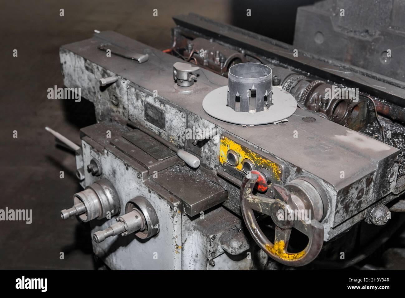 Old milling machine equipment in the workshop of an industrial plant ...