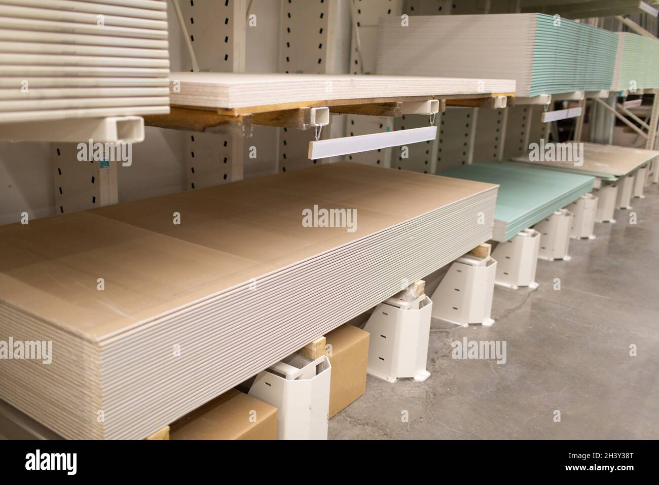 Pallet with Drywall sheets plasterboard in the building warehouse store ...