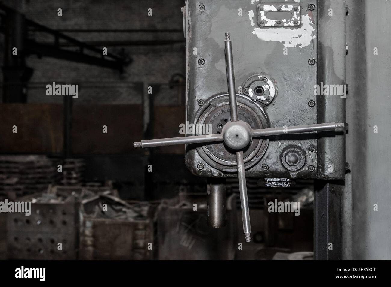 Part of an old milling machine with an iron handle for working with ...