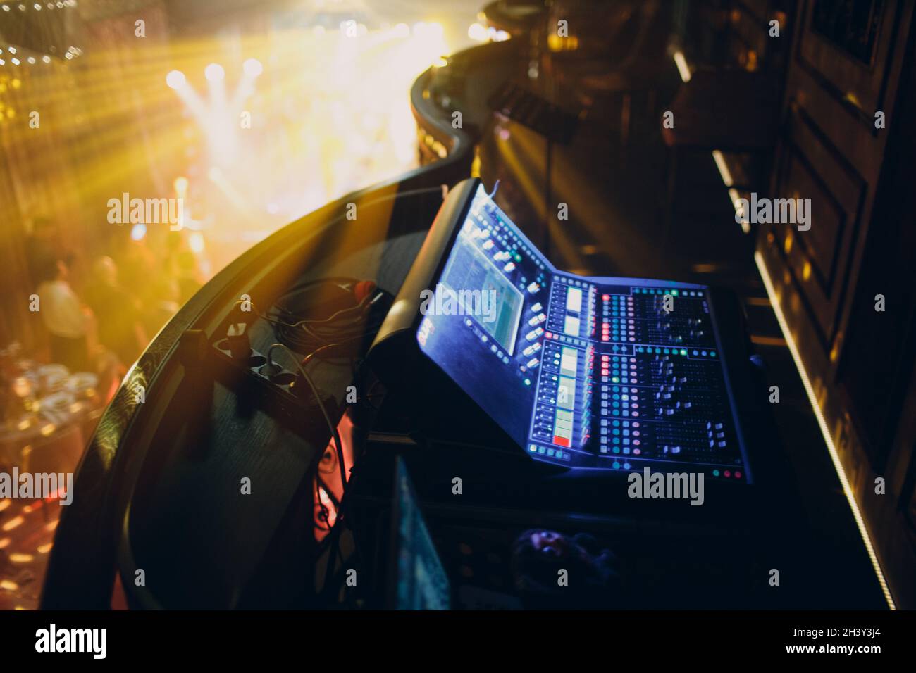Mixing console, hand equalizing audio sound channels in night club ...