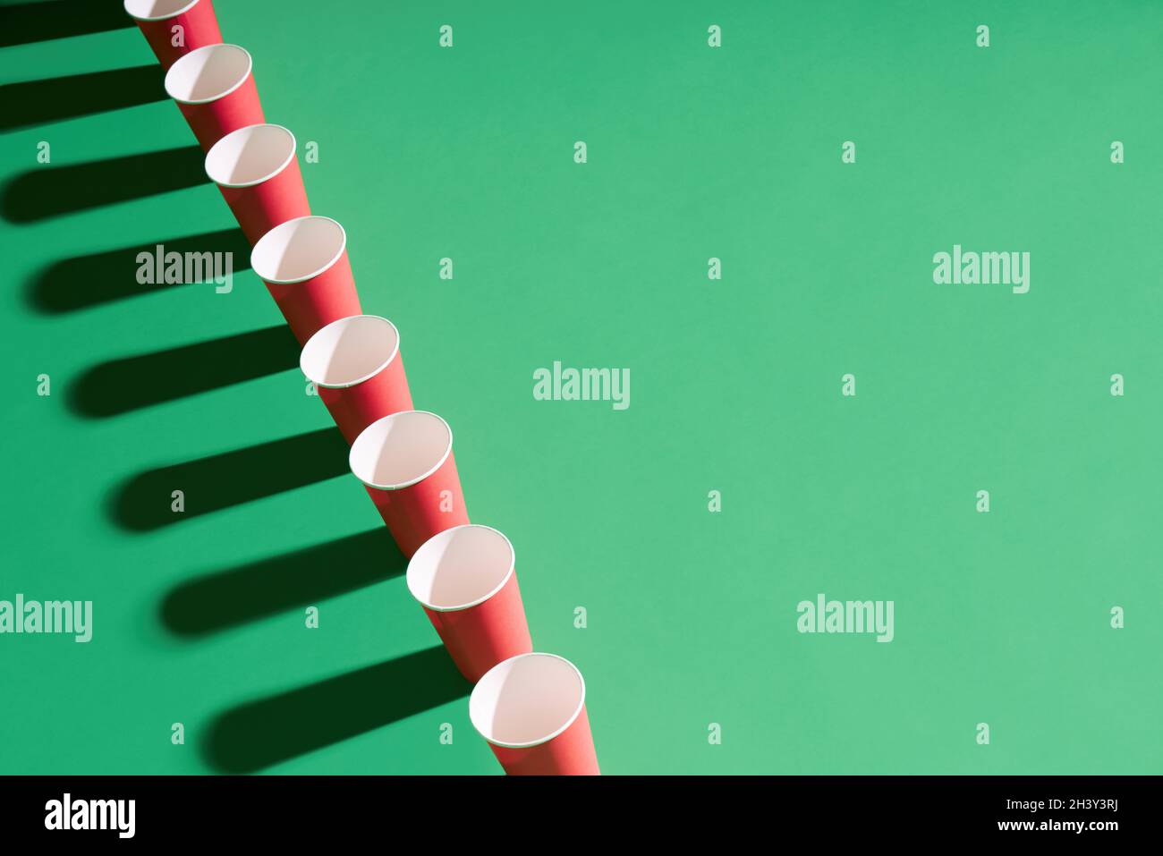Row of red paper cup on green background with copy space Stock Photo ...